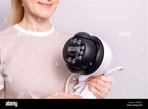 Smiling Caucasian Woman Holds Ip Alarm Security System Intruder Video Monitoring Surveillance