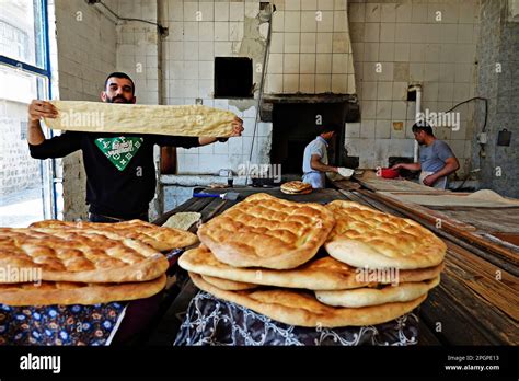 Ferhat Erzem Is Seen Showing The Lavash Breads That Were Baked And
