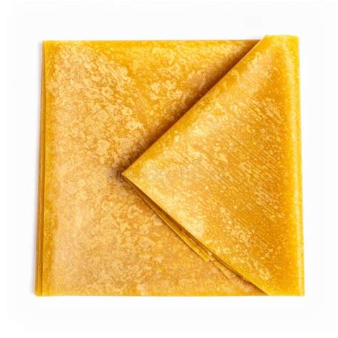 Close Up Of Golden Yellow Homemade Folded Flatbread In Square Shape