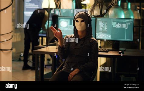 Female Hacker With Anonymous Mask Using Hologram To Break Into Firewall Encryption Holographic Female Hacker With Anonymous Mask Using Hologram To Break Into Firewall Encryption Holographic