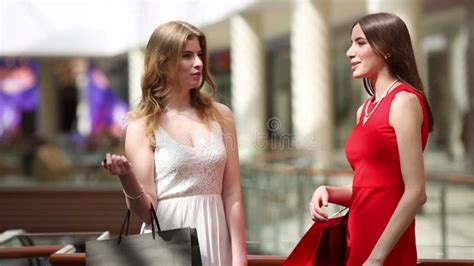 Two Pretty Girls With Bags Talk In Big Modern Stock Video Video Of