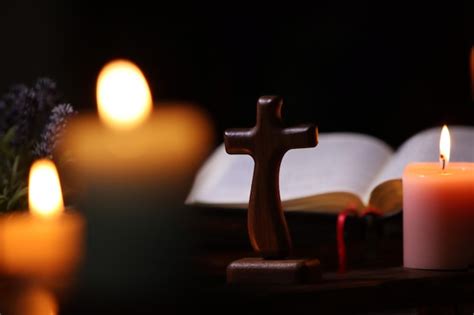 Premium Photo Bible Candle And Holy Cross