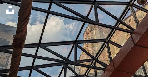 A View Of A Building Through A Glass Roof Photo Free Restaurant Image