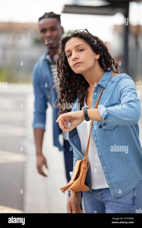 Queue Of People Waiting At Bus Stop Stock Photo Alamy