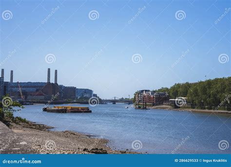 Battersea Power Station At Banks Of Thames River With Blue Sky In Background Stock Image Image