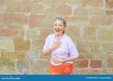 Outdoor Portrait Of Happy And Healthy Mature 50 55 Year Old Woman