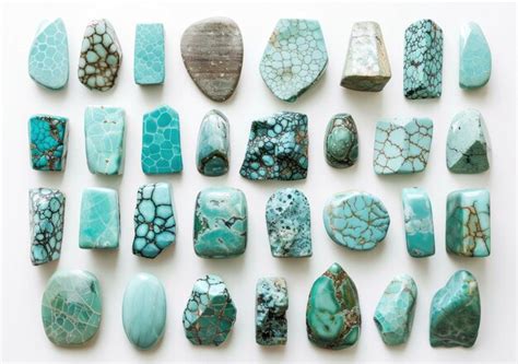 Collection Of Turquoise Gemstones Arranged On A White Background
