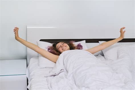 Premium Photo Pretty Happy Girl Waking Up In The Morning And