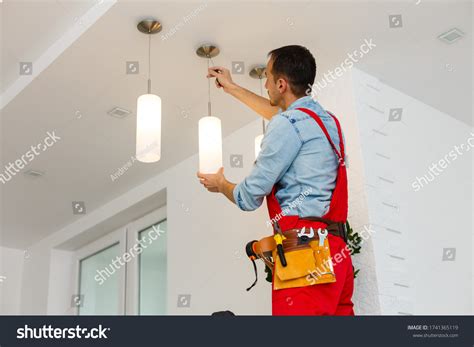 Electrician Man Worker Installing Ceiling Lamp Stock Photo 1741365119 Shutterstock