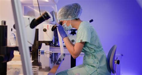 Embryologist Conducting Artificial Fertilization In Laboratory Stock