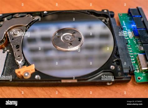 The Hard Disk Is Lying On The Table Blinking And Spinning The Disk Work Of A Hacked Hard Drive