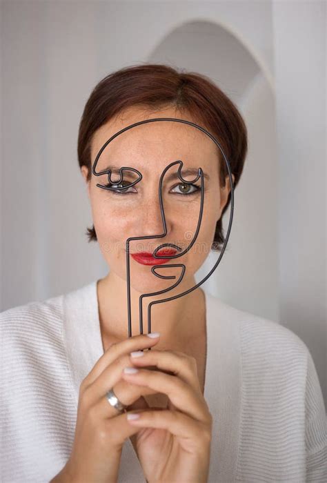 Symbolic Question Mark In Front Of The Face Of A Beautiful Woman In