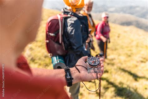 Guided By A Compass Hikers Prepare For Their Next Adventure Stock