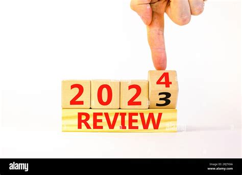 2024 Review New Year Symbol Businessman Turns A Wooden Cube And