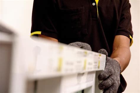 Premium Photo Midsection Of Worker Holding Window Frame At Home