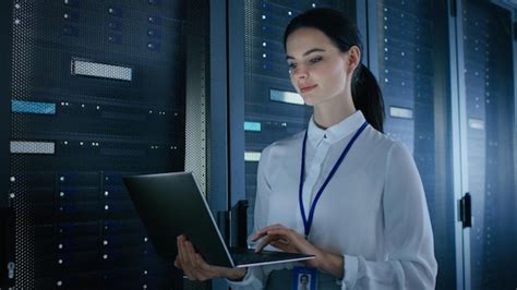 Premium Photo A Woman In A Server Room With A Laptop