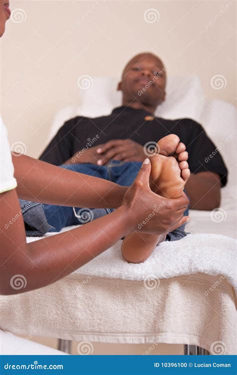 Foot Massage By Wood Stick Royalty Free Stock Image