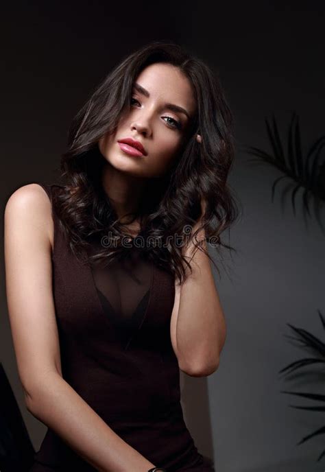 Beautiful Brunette Makeup Woman With Pink Lipstick And Long Curl Stock