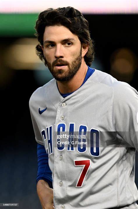 Dansby Swanson Of The Chicago Cubs Waits For His Hat And Glove During