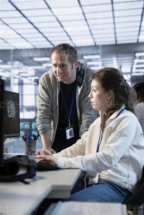 Manager Checking Project Progress Of Technician Programming In Ai Data