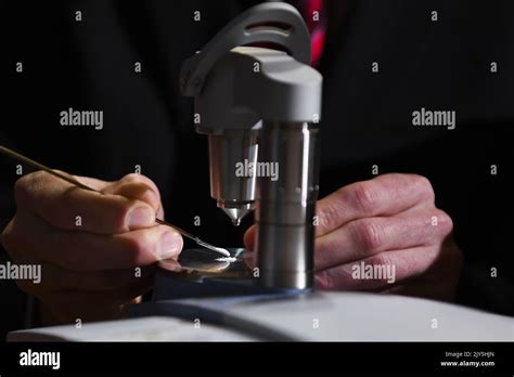 A Man Uses The Compact FTIR Spectrometer Pill Testing Machine During A Demonstration Event At