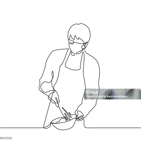 남자 요리사가 얼굴에 마스크를 쓰고 요리하고 있다 마스크를 쓰고 프록 코트를 입고 깊은 그릇에 계란을 휘젓는 요리사의 한 선