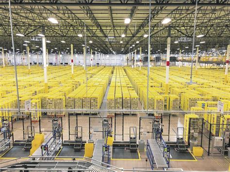 robotic warehousing operations a learn then optimize approach to large scale neighborhood