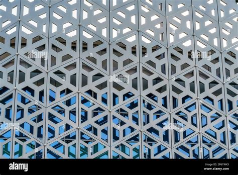 The Texture Of The Cladding Of A Building Made Of Metal Aluminum Panels With A Carved Pattern