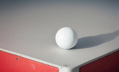 Premium Ai Image Contrasting Unity White Ball On Top Of Red Cube