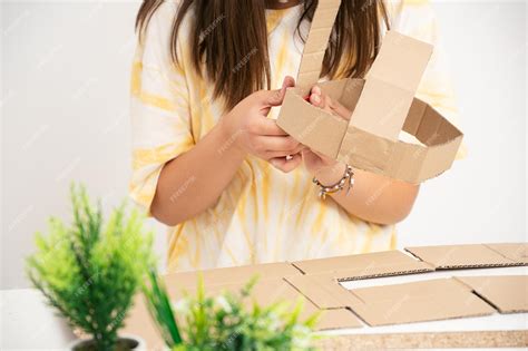Premium Photo Woman39s Hands Doing Crafts Putting The Cardboard