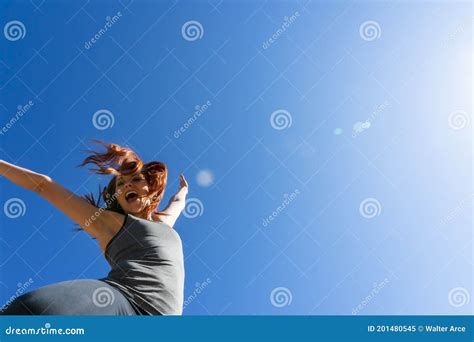 A Gorgeous Redhead Fitness Model Preparing To Play Volleyball Stock Image Image Of Athlete