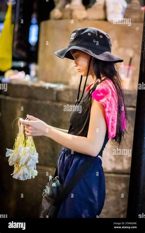 A Pretty Young Filipino Girl Sells Flower Garlands At Santo Nino De