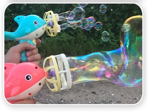 깜박이는 음악과 귀여운 만화 돌고래 모양 팬과 자동 버블건 메이커 다채로운 비누 어린이 부는 기계 장난감버블 Aliexpress