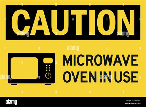 Microwave Oven In Use Caution Sign Black On Yellow Background Safety
