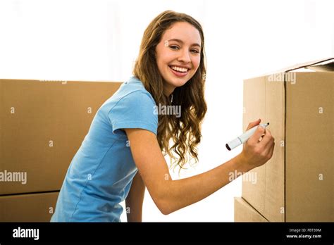 Girl Writing On Boxes Stock Photo Alamy