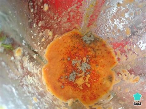 An Orange Substance In A Blender Filled With Liquid