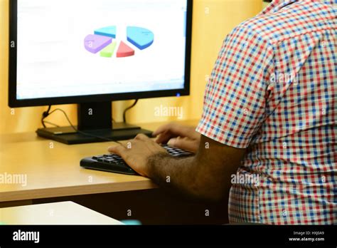 A Man Typing On Computer Keyboard Stock Photo Alamy