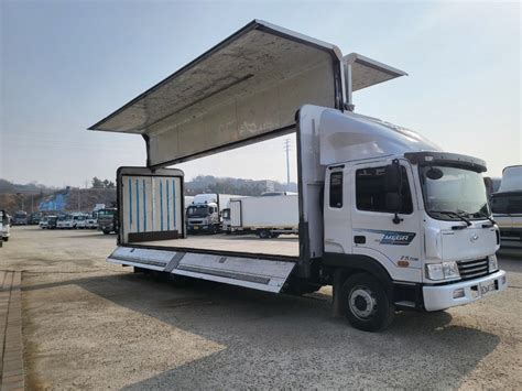 현대 메가 75톤 후축 윙바디 파워게이트 장착 무시동 히터 후방 카메라 O 윙 길이 83m 엔진 미션 윙 하부 상태 A전문가들