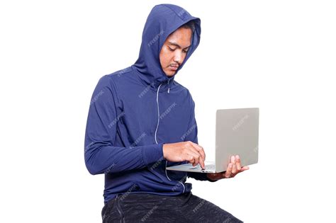 Premium Photo Hacker In Blue Hoodie Using Laptop Isolated On White Background