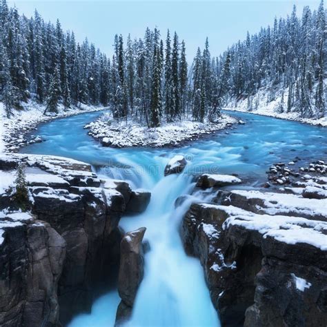 Cold Scenery At Sunwapta Falls In The Canadian Rockies With Snow And