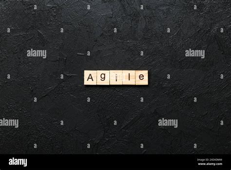 Agile Word Written On Wood Block Agile Text On Cement Table For Your Desing Concept Stock