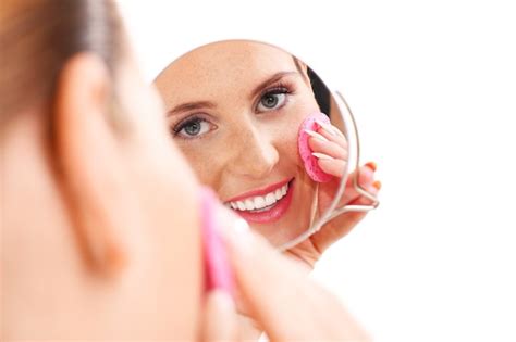Premium Photo Sensual Woman Removing Makeup Over White Background