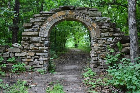 Premium Photo Stone Arch Entrance Wall With Ivy In The Garden