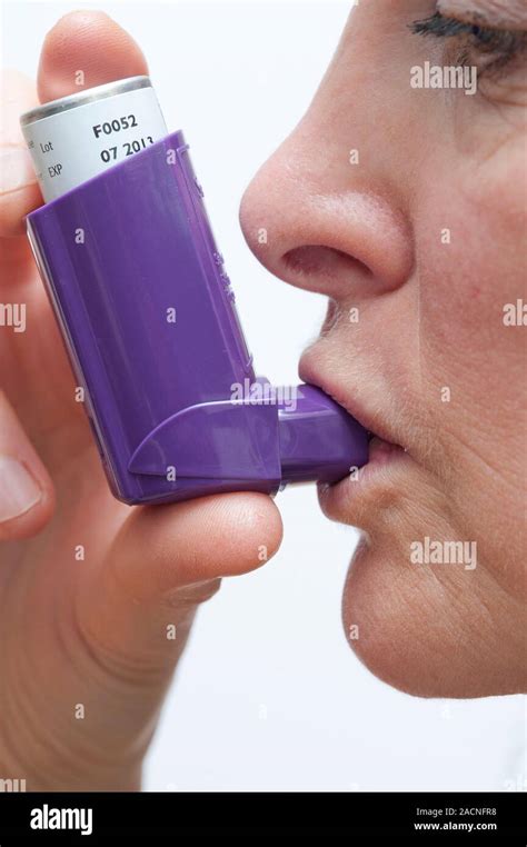 Adult Female Patient Uses A Seretide Inhaler To Treat Asthma Or Copd This Seretide Inhaler