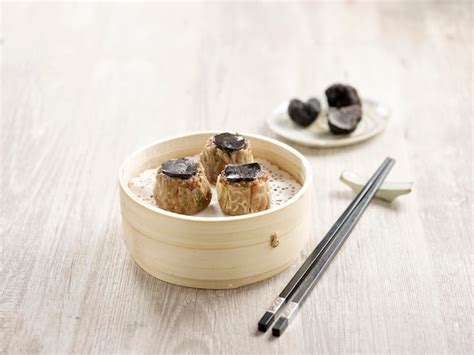 Premium Photo Steamed Beef Dumpling With Truffle Served In A Wooden Bowl Side View On Grey