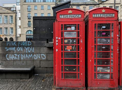 Two Red Telephone Booths With Graffiti On Wall Photo Free Retro Image