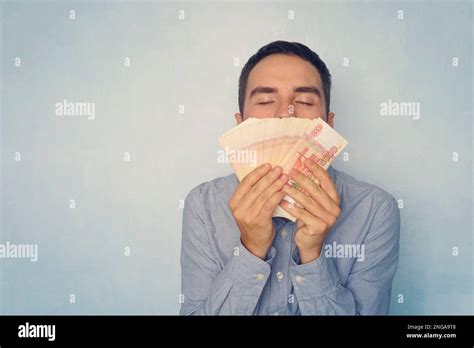 Man Sniffing Dollars The Sweet Smell Of Money Young Guy Sniffing 5000
