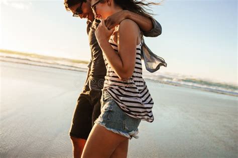 Couple Strolling Together On Beach On A Summer Day Stock Image Image