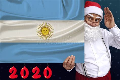 Santa Claus With A Beard Holds A Beautiful Colored National Flag Of The