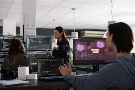 It Engineer Looking At Monitor Reading Critical Error In It Big Data Agency Stock Image Image
